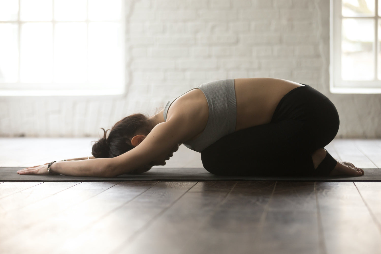 5 Yoga Stretches That Help With Stress & Anxiety - Practicing Yoga For ...